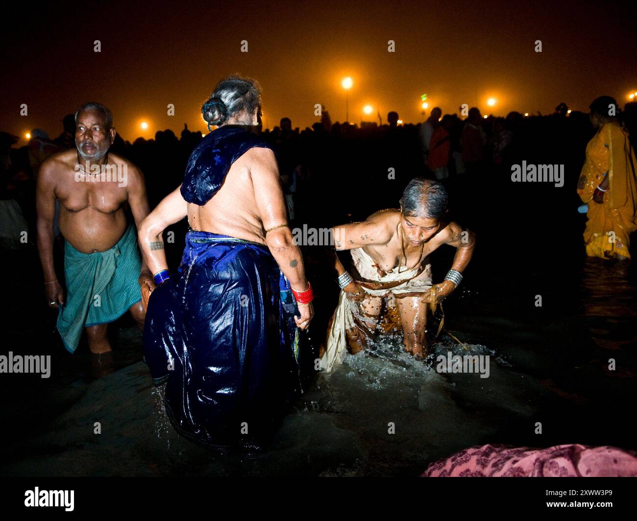 Night bathing ceremony at the Ganges river during the Gangasagar Mela ...