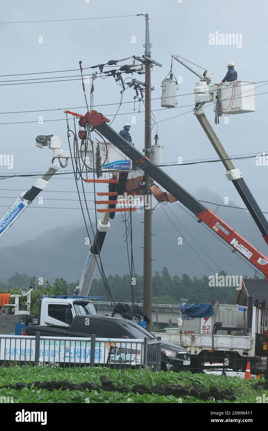 21st Aug, 2024. Aftermath of Typhoon Jongdari Engineers repair a ...