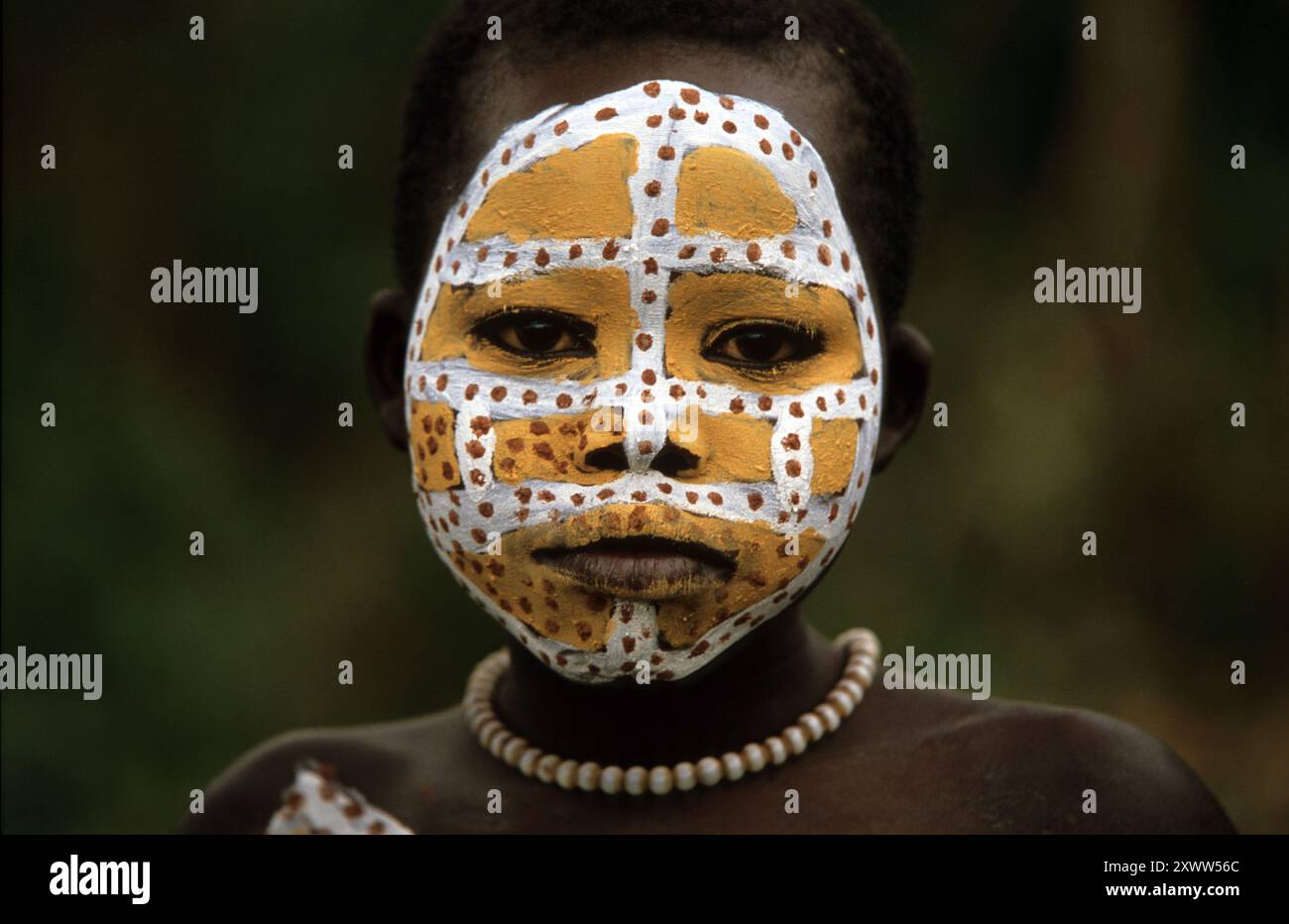 Portrait of a colorful Surma girl taken in a small village near the ...