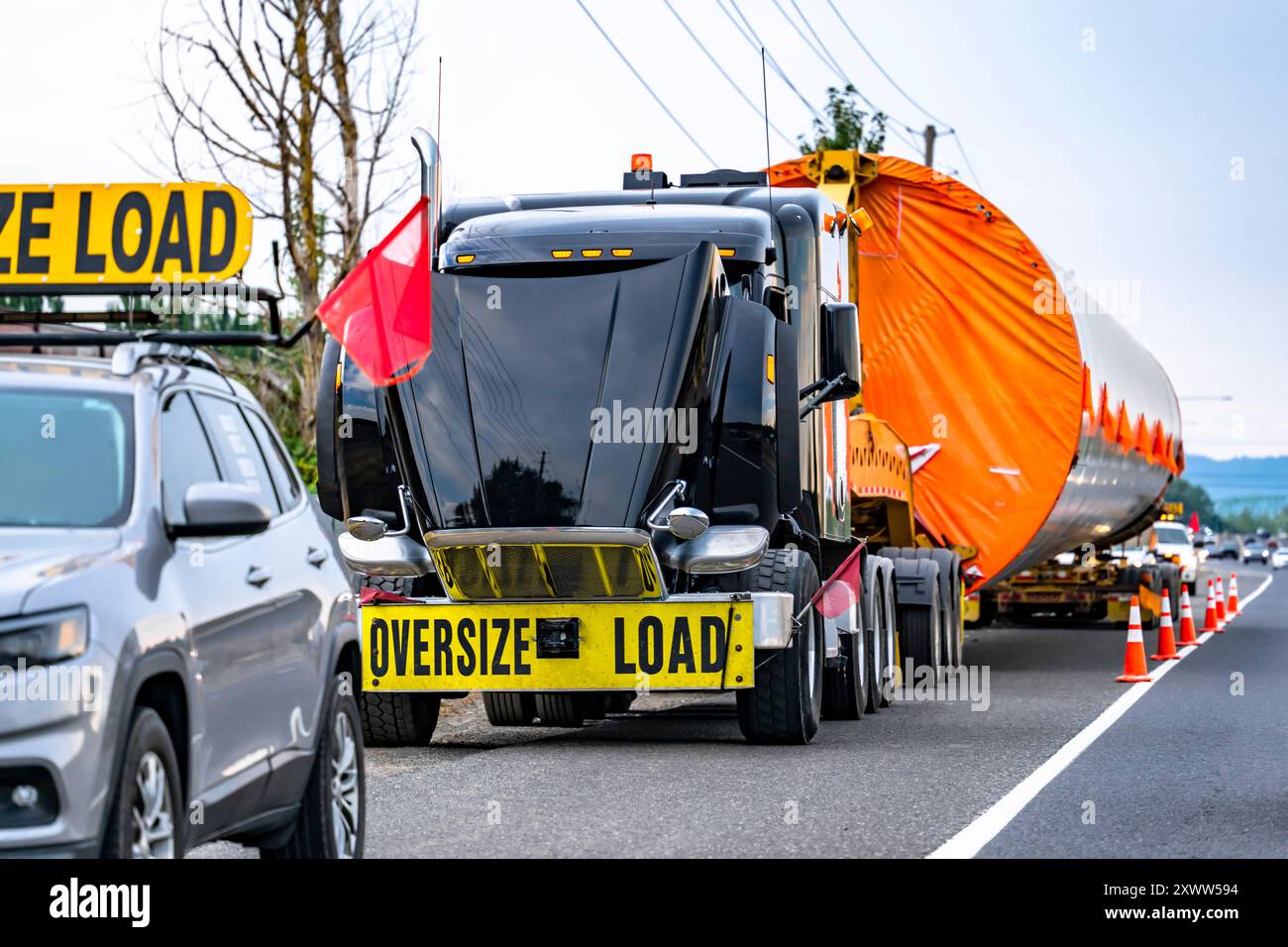 Industrial black broken big rig semi truck with open hood and oversize ...
