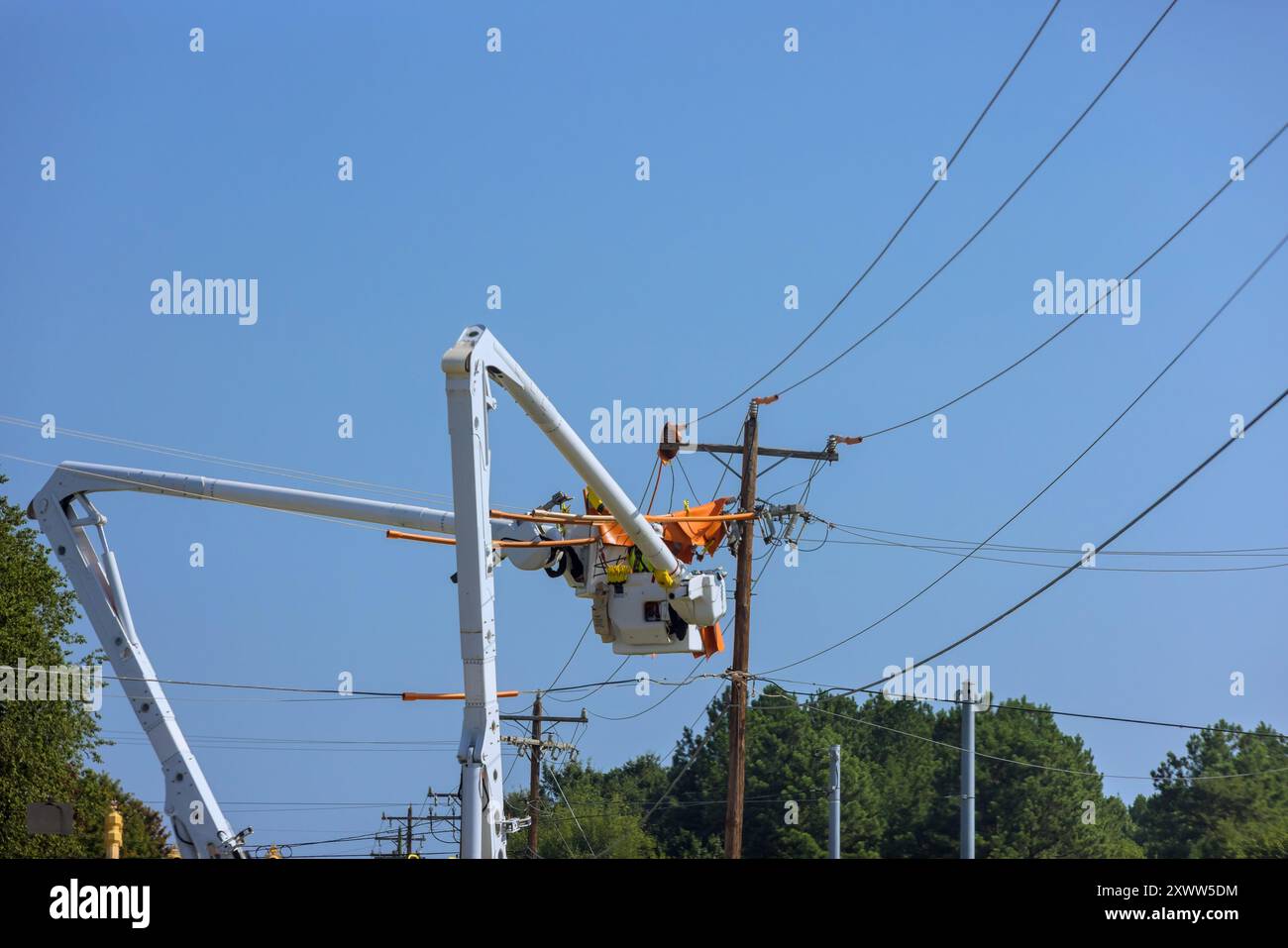 Keeping power lines in repair service requires use of insulated ...