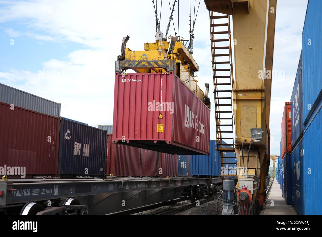 Harbin. 6th Aug, 2024. A container is being loaded at Manzhouli Railway Port in north China's ...