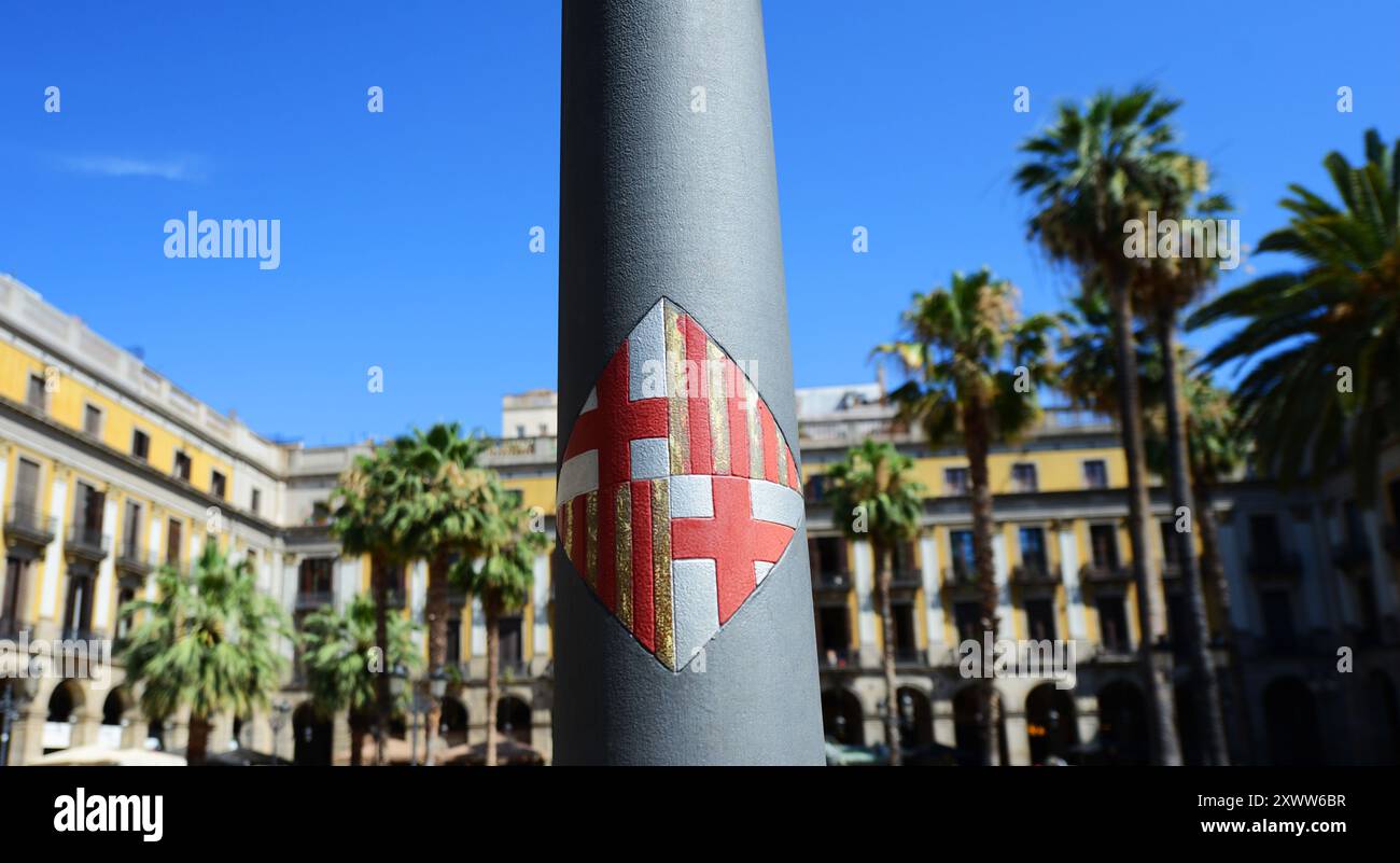 A Catalonian coat of arms on a column at the Plaça Reial / Royal square ...