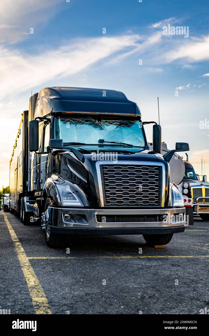 Industrial standard long haul big rig semi truck tractor take a break ...