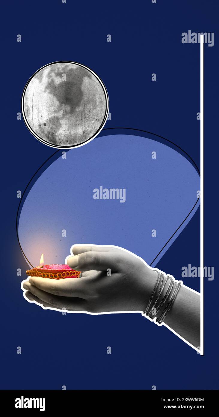 A hand holding a candle in front of a moon. Concept of Diwali day, the ...