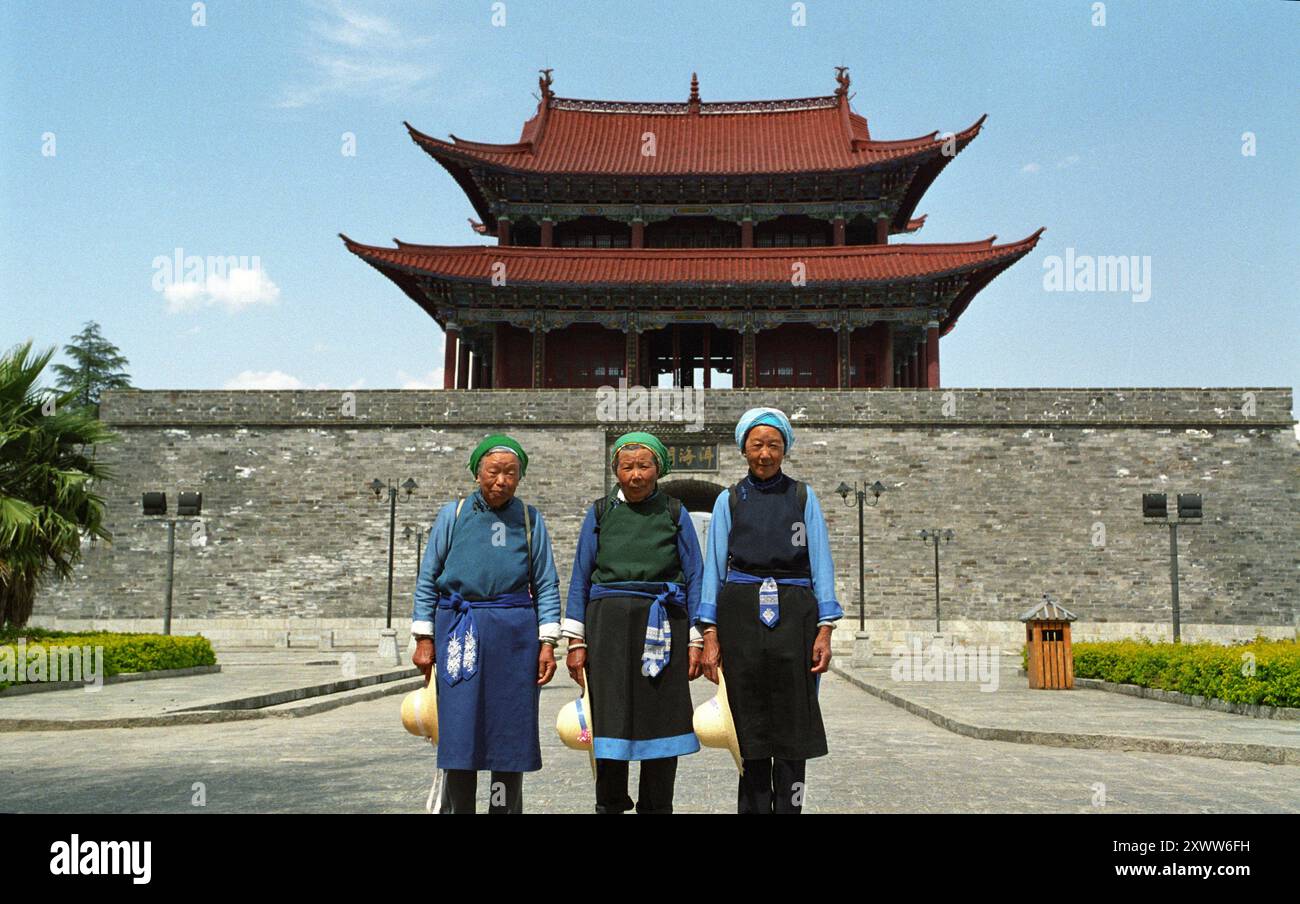 Bai women in front of the Southern gate of the old city of Dali. Yunnan ...