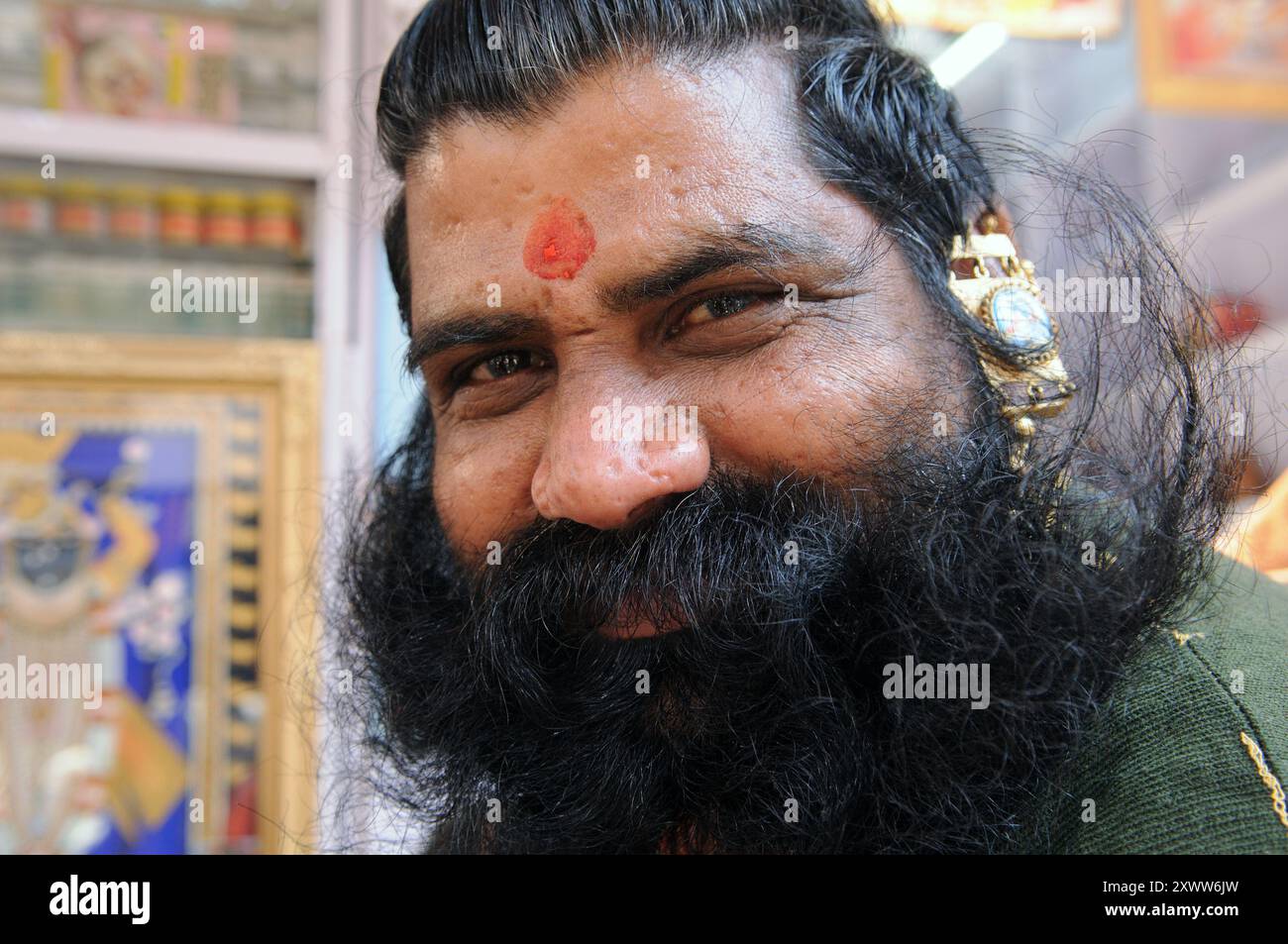 Portrait of a very colorful and big Indian man. This man's hobby is to ...