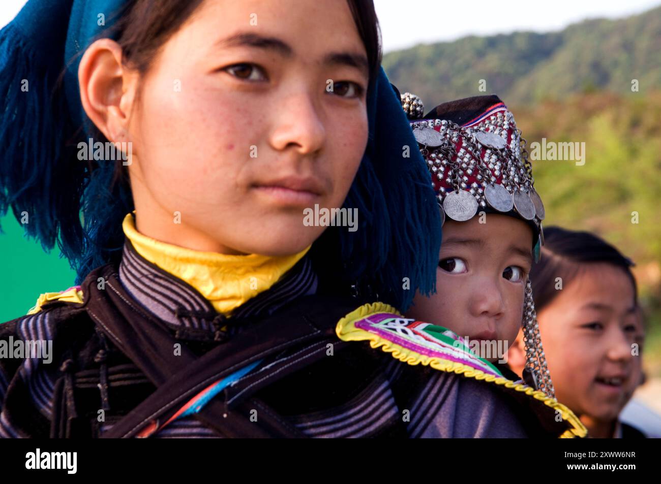 A Hani ( Akha ) woman with her baby. Yuanyang, Yunnan, China Stock ...