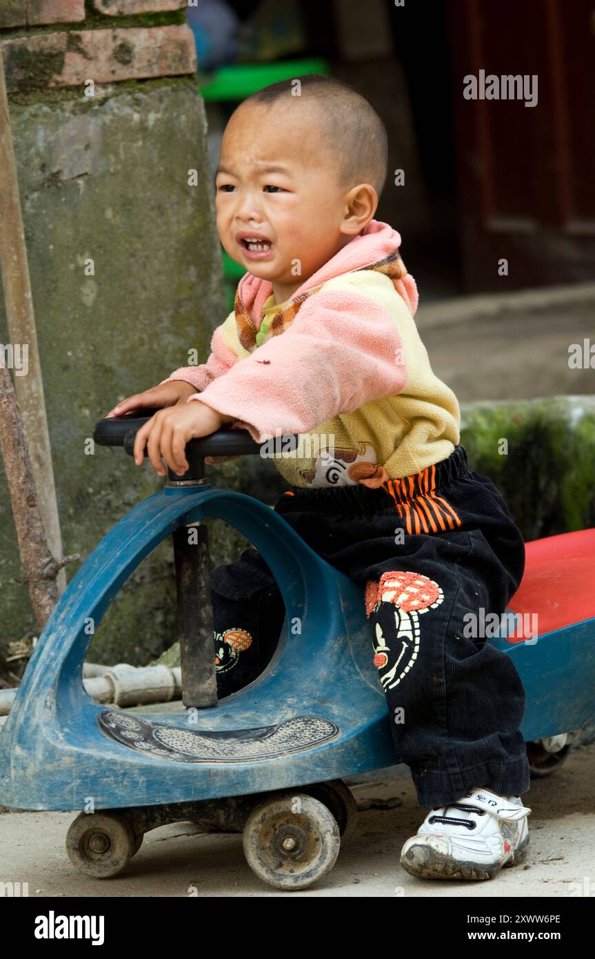 A Chinese toddler playing near his house in a small village in Yuanyang ...