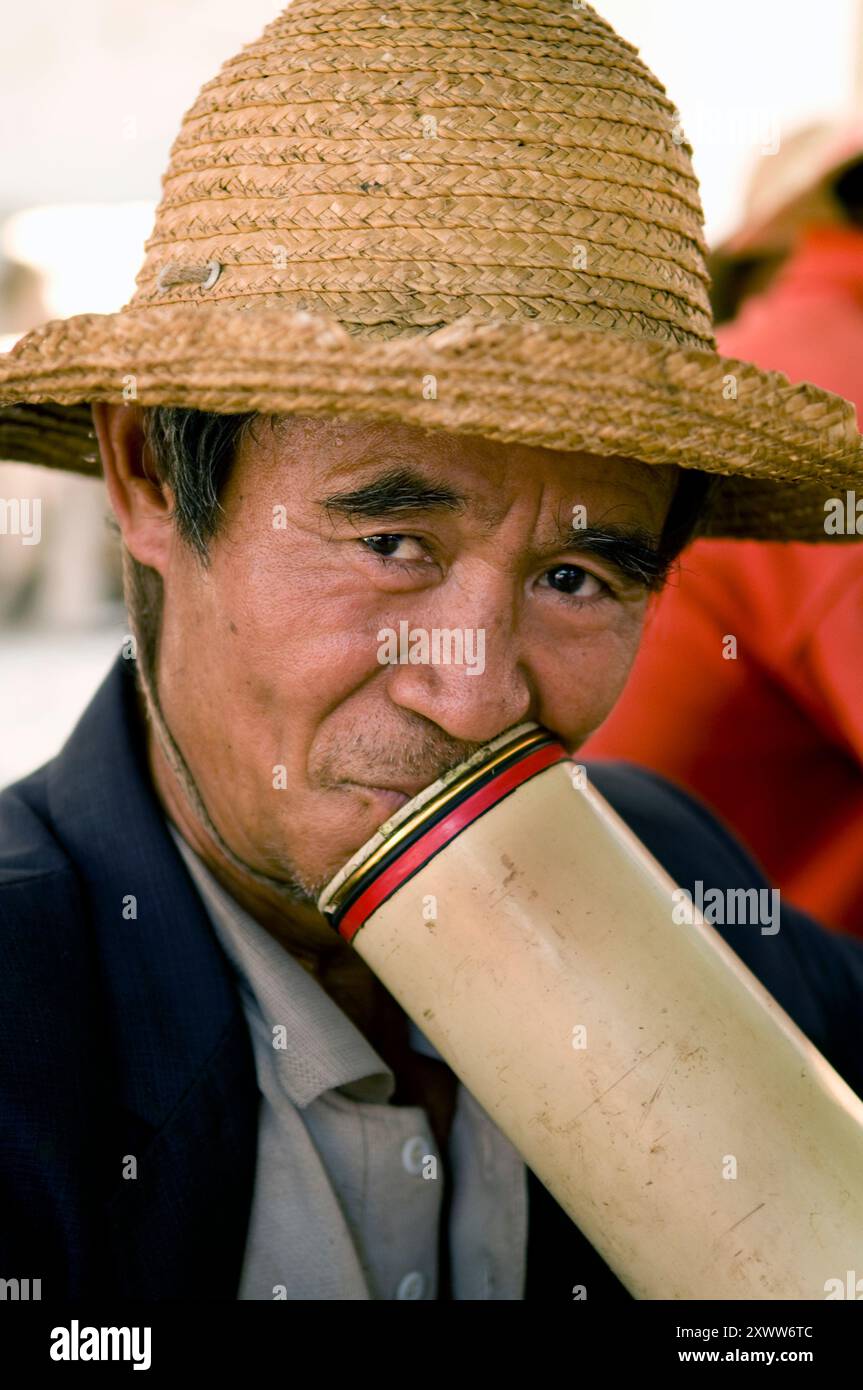 Afternoon smoke with a traditional Bamboo pipe. Photo taken at the ...