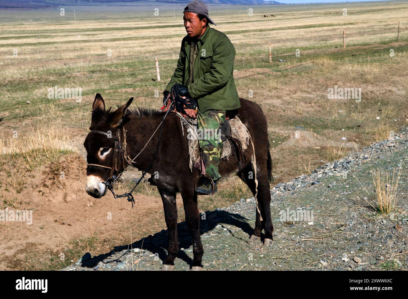 A Kazakh man riding his mule in the Ili Kazakh Autonomous Prefecture in ...