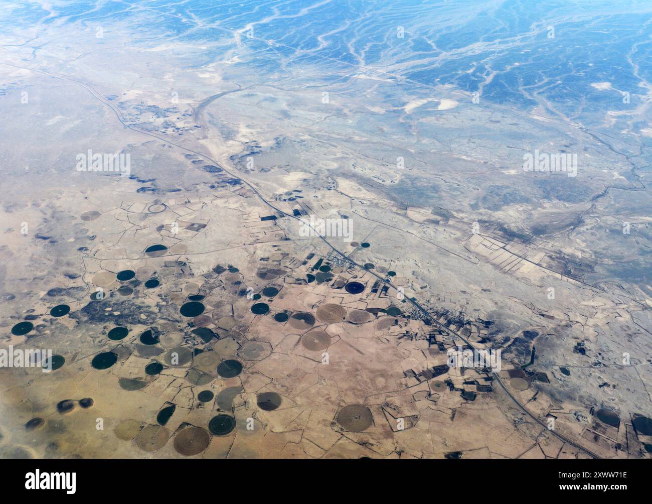 Aerial view of circular agriculture fields in the Arabian desert in ...