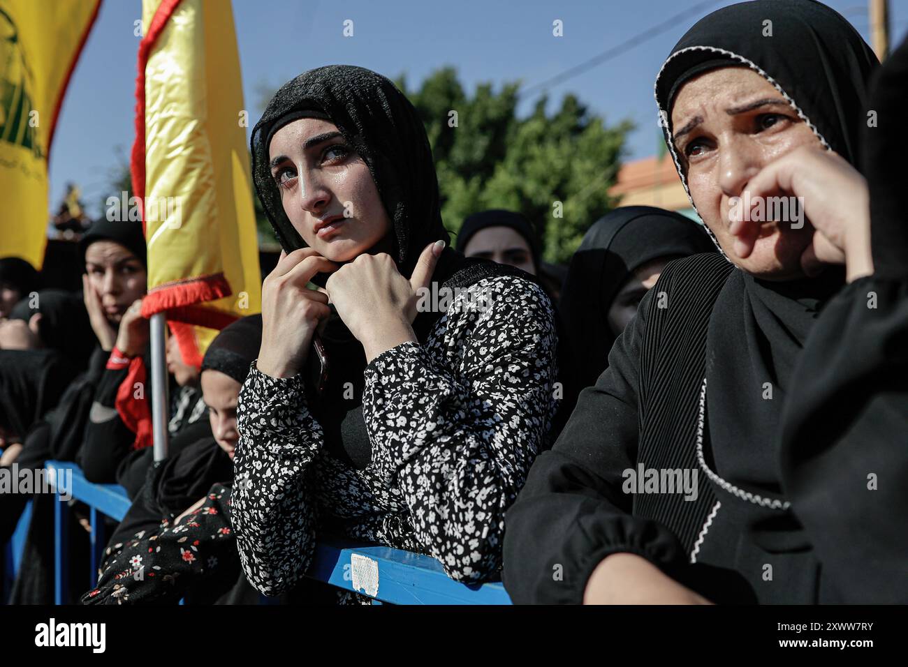 A woman looks on during the funeral ceremony of Hezbollah fighter Abbas ...