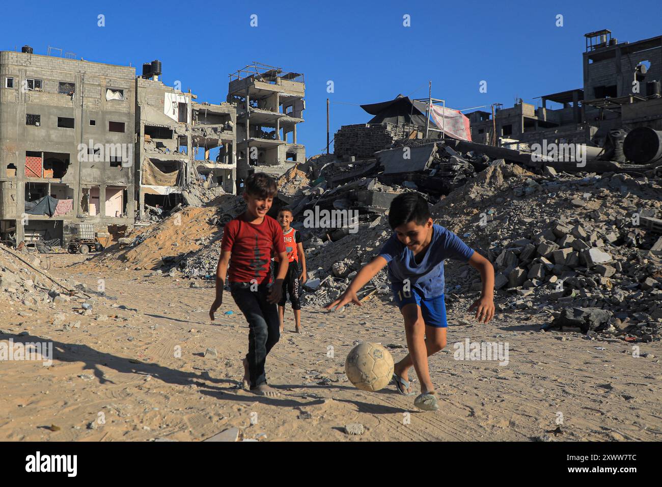 Palestinian children play football in hi-res stock photography and ...
