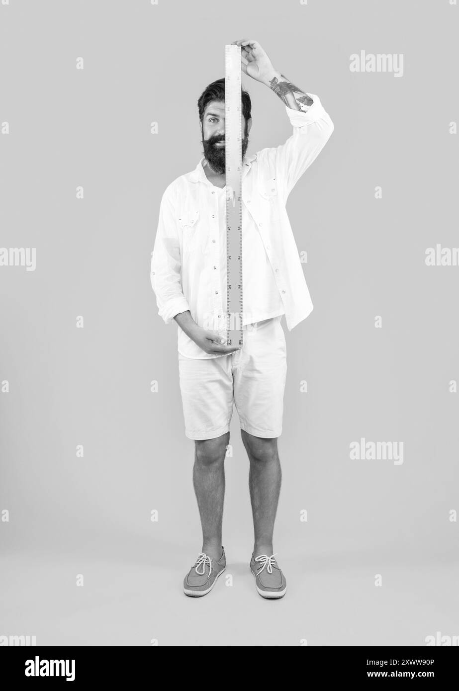 cheerful man with measuring ruler on background. photo of man with ...