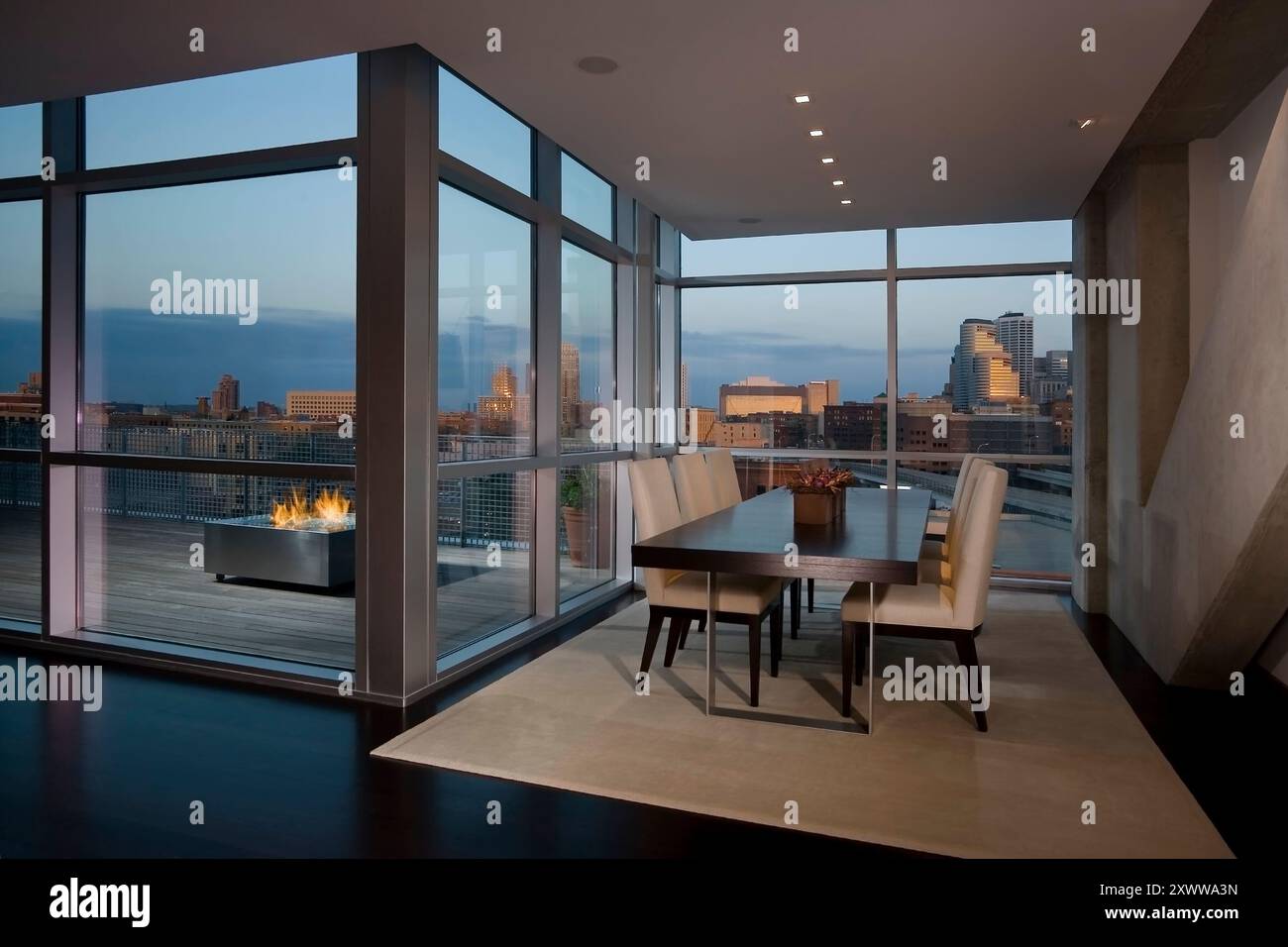 Floor to ceiling windows with view of downtown area hi-res stock ...