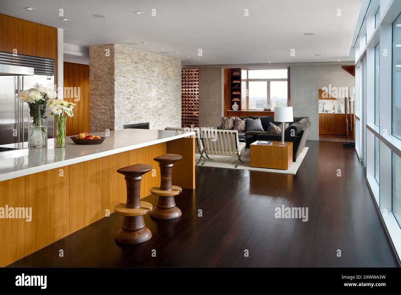 Modern apartment living room showing part of kitchen island Stock Photo ...