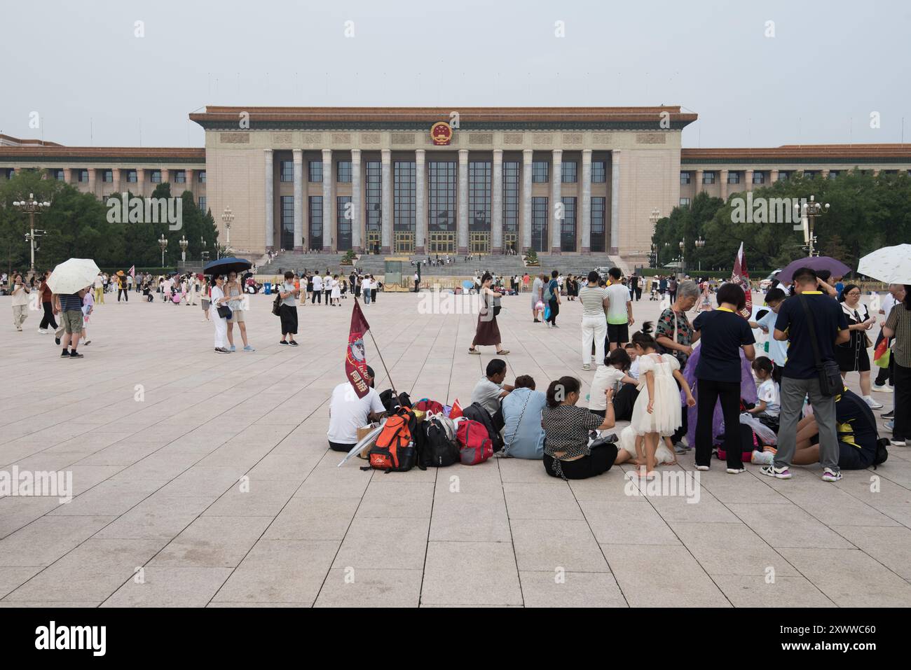 Beijing, China - August 17, 2024: Tourists resting in Tiananmen Square ...