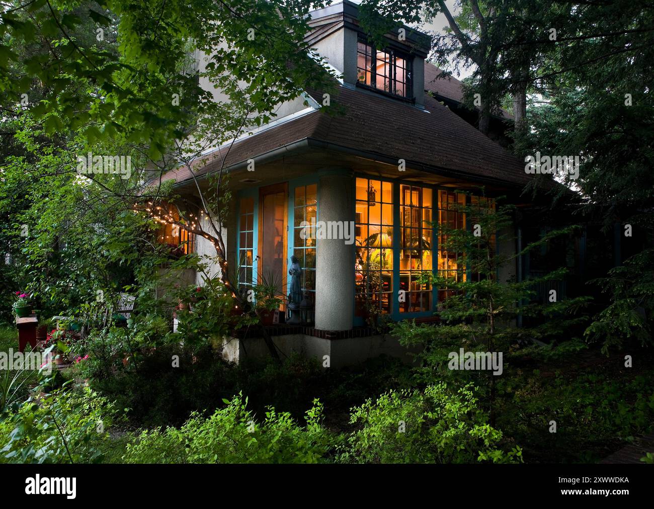 View into windows of house at dusk Stock Photo - Alamy