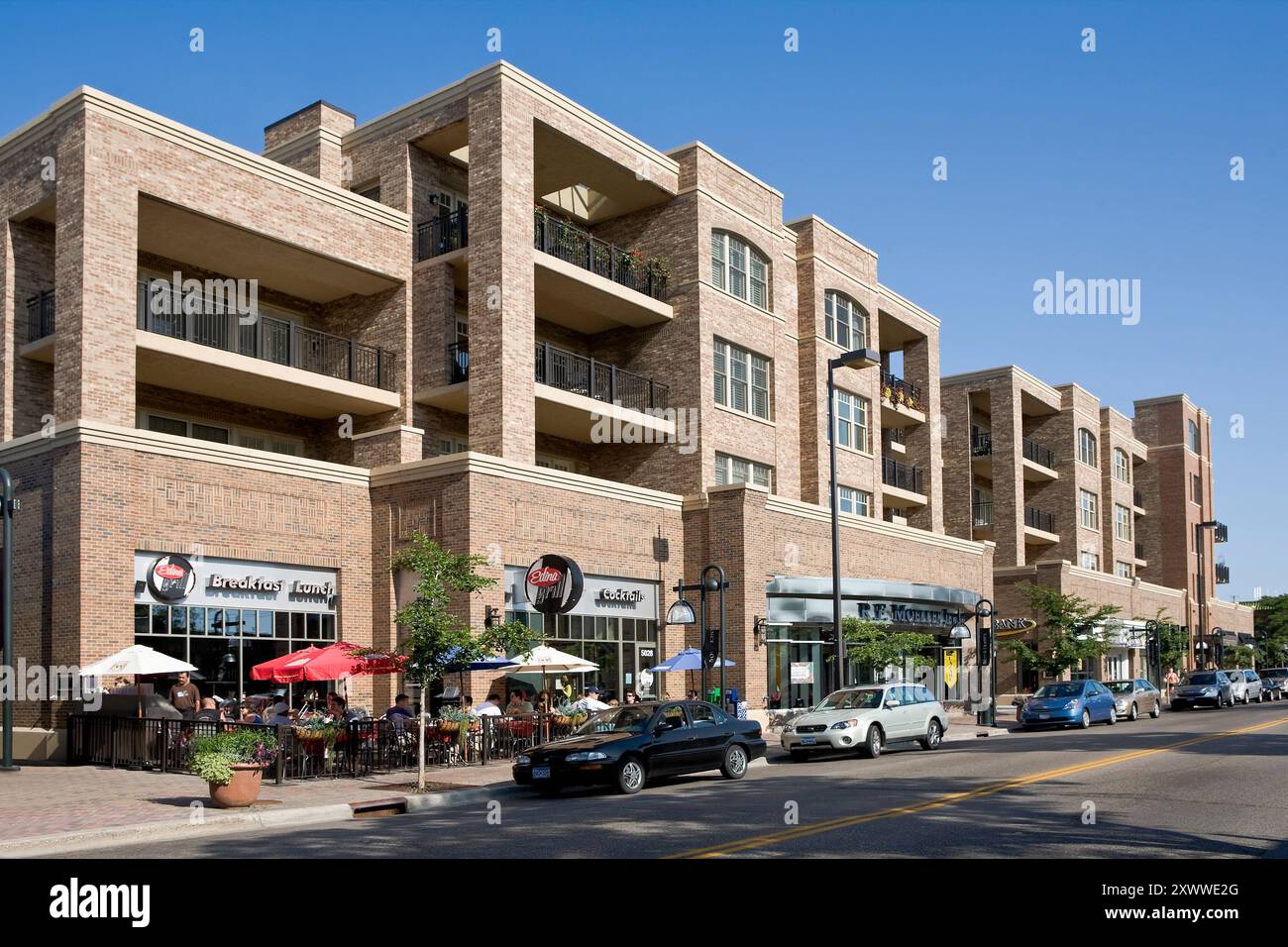 Condominium project showing streetscape and sidewalk cafe Stock Photo ...