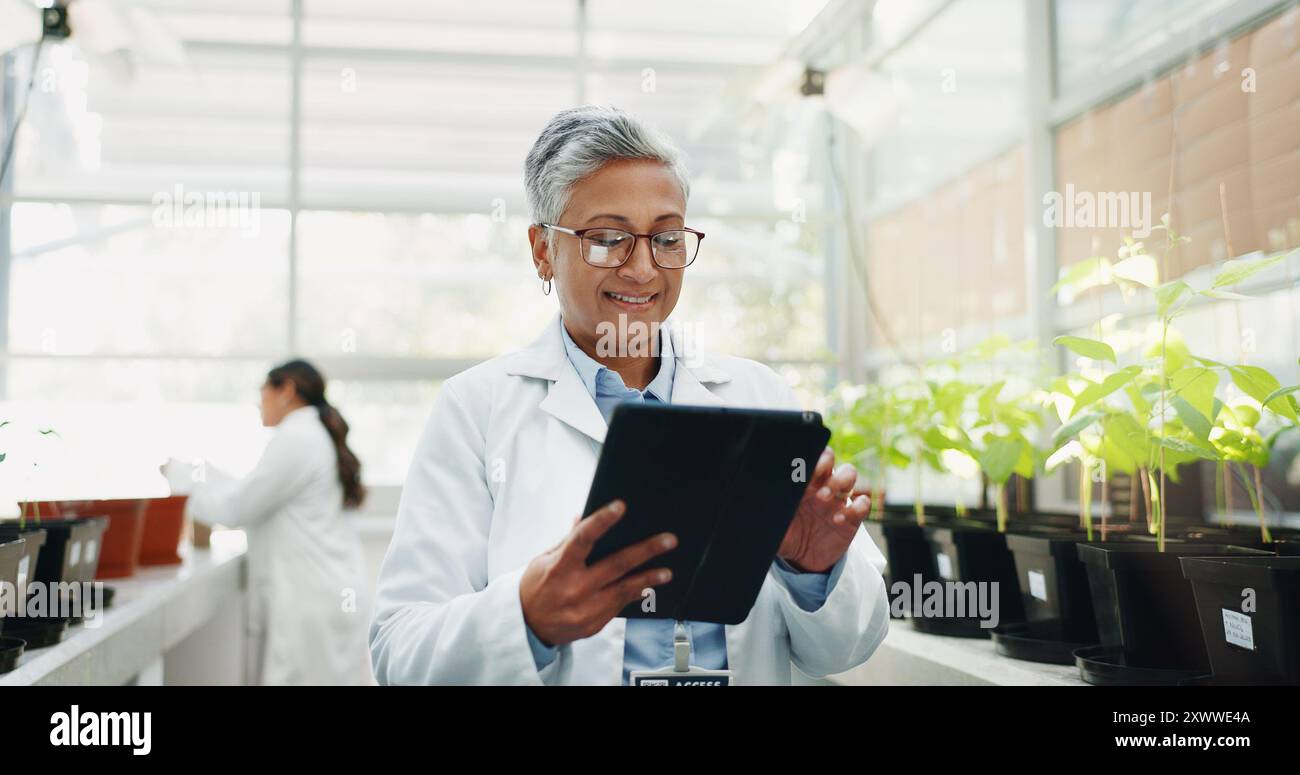 Happy, woman and science with tablet in greenhouse for biochemistry ...