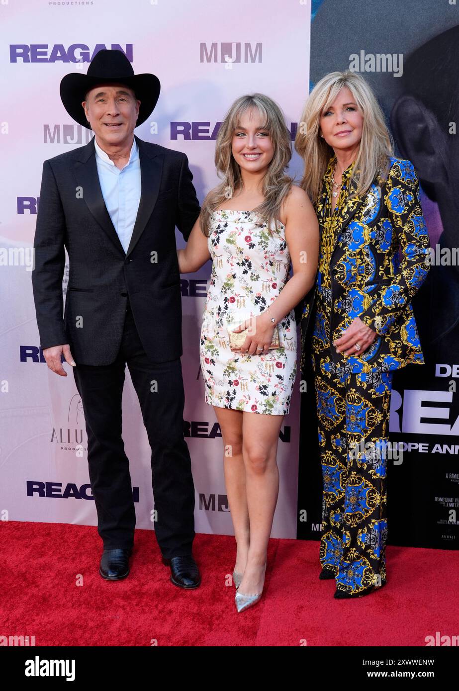 Country singer Clint Black, left, poses with his wife Lisa Hartman ...