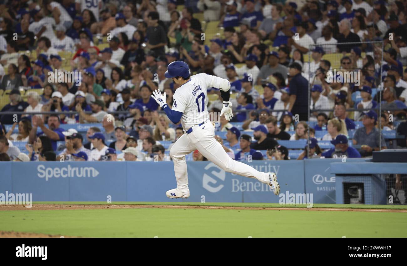 Los Angeles Dodgers designated hitter Shohei Ohtani runs the bases ...