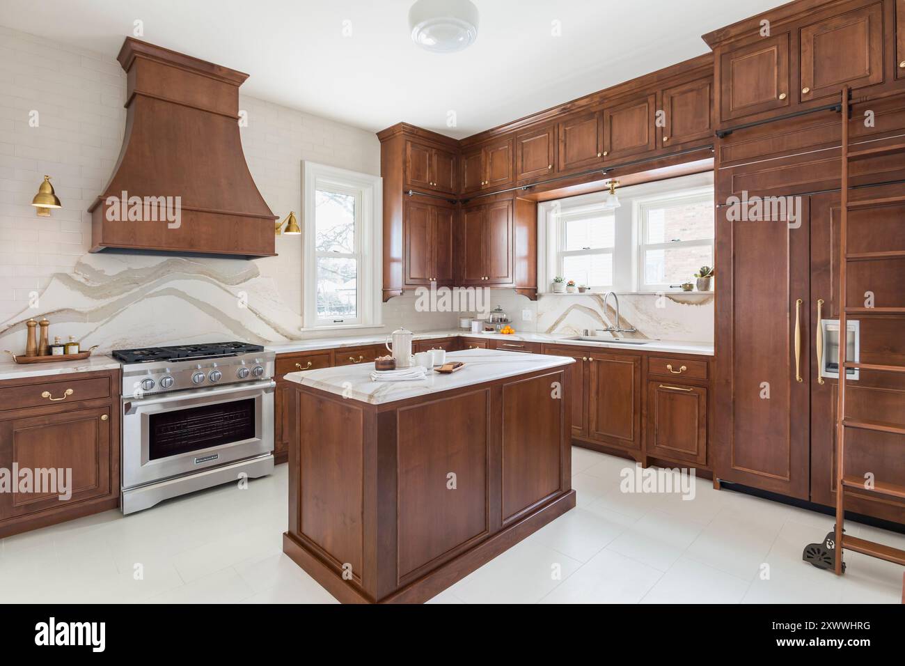 A bright sunny traditional kitchen with dark cabinets and modern ...