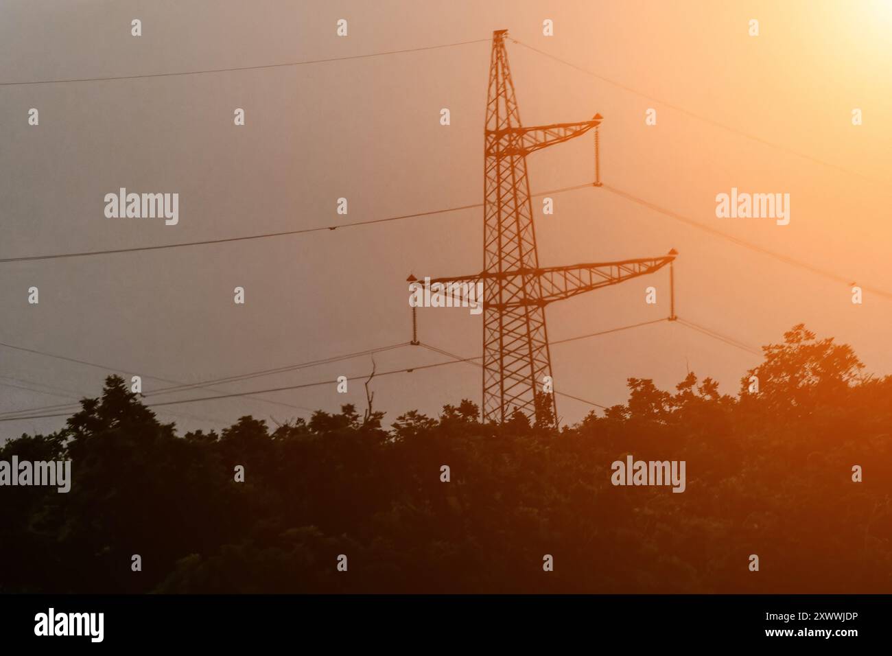 High voltage electric distribution network at sunset. Power ...