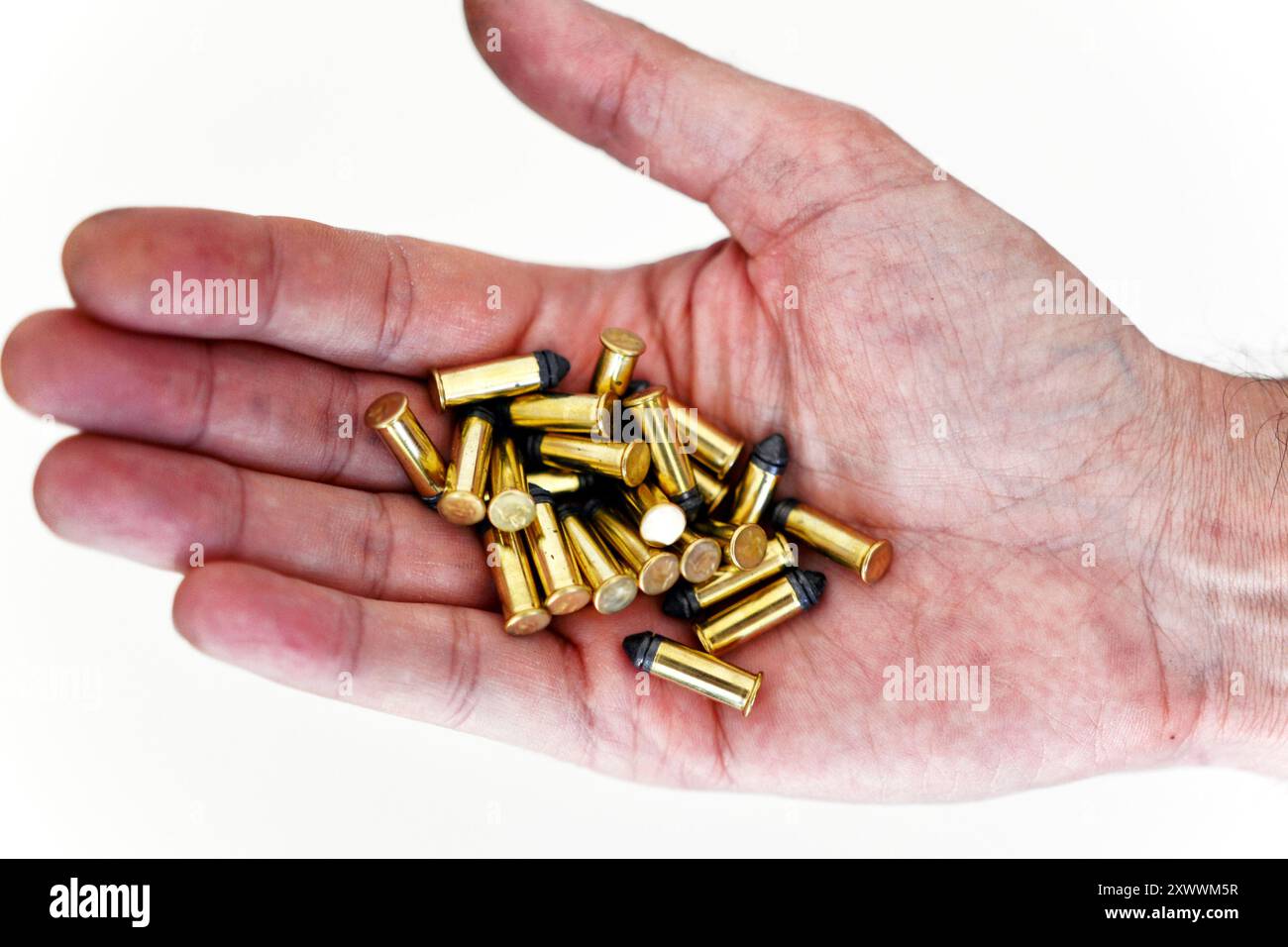 Hand showing bullets - concepts of weapons and conflicts Stock Photo ...