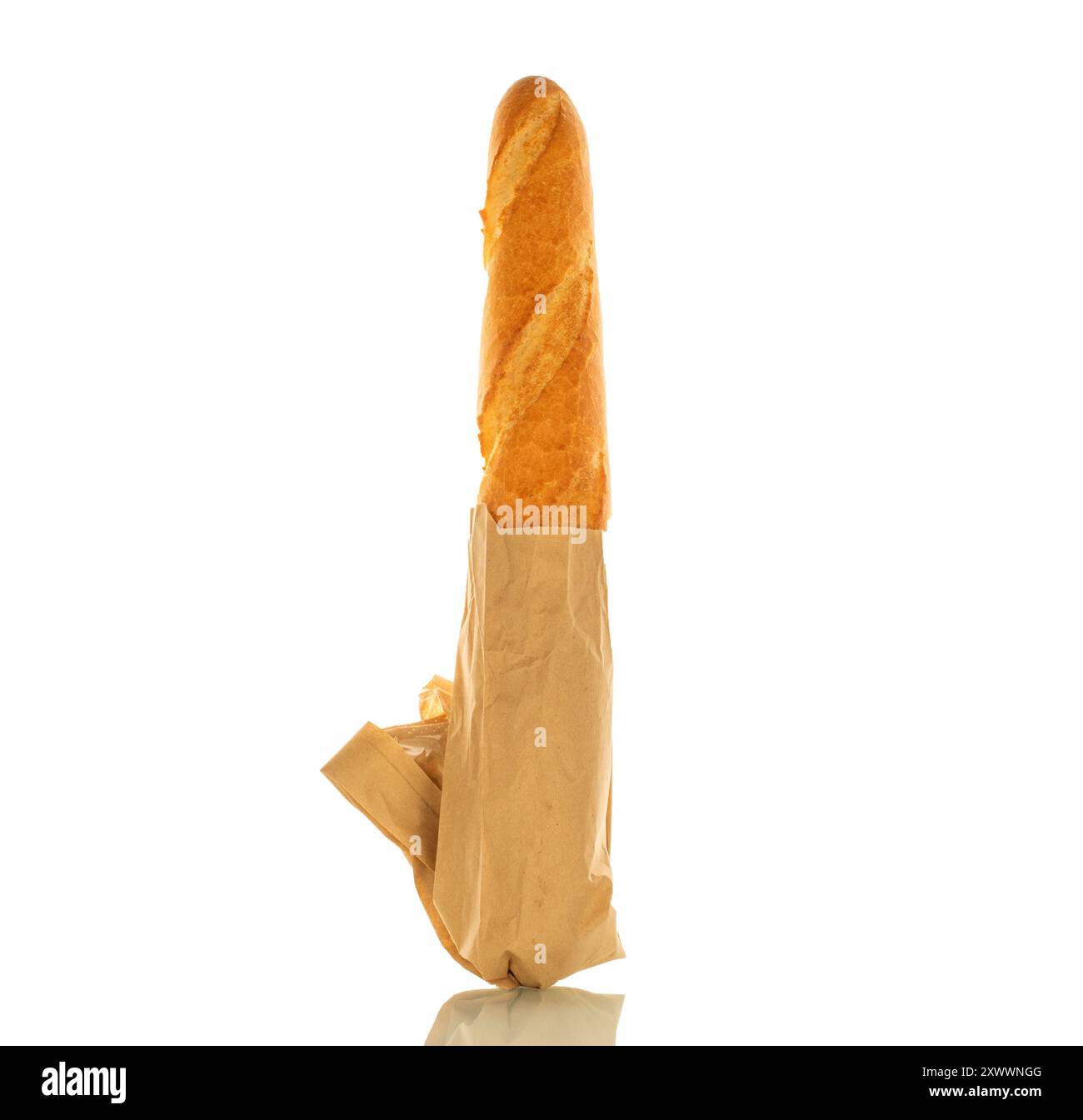 One aromatic baguette in a paper bag, macro, isolated on white ...