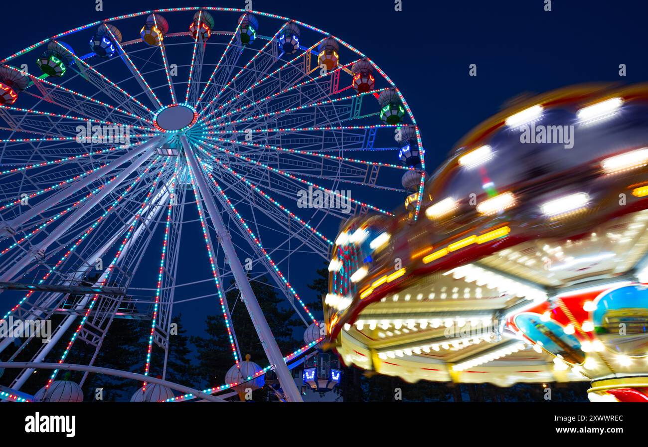 A colourful ferris wheel in Luna park during night. Horizontal photo of ...