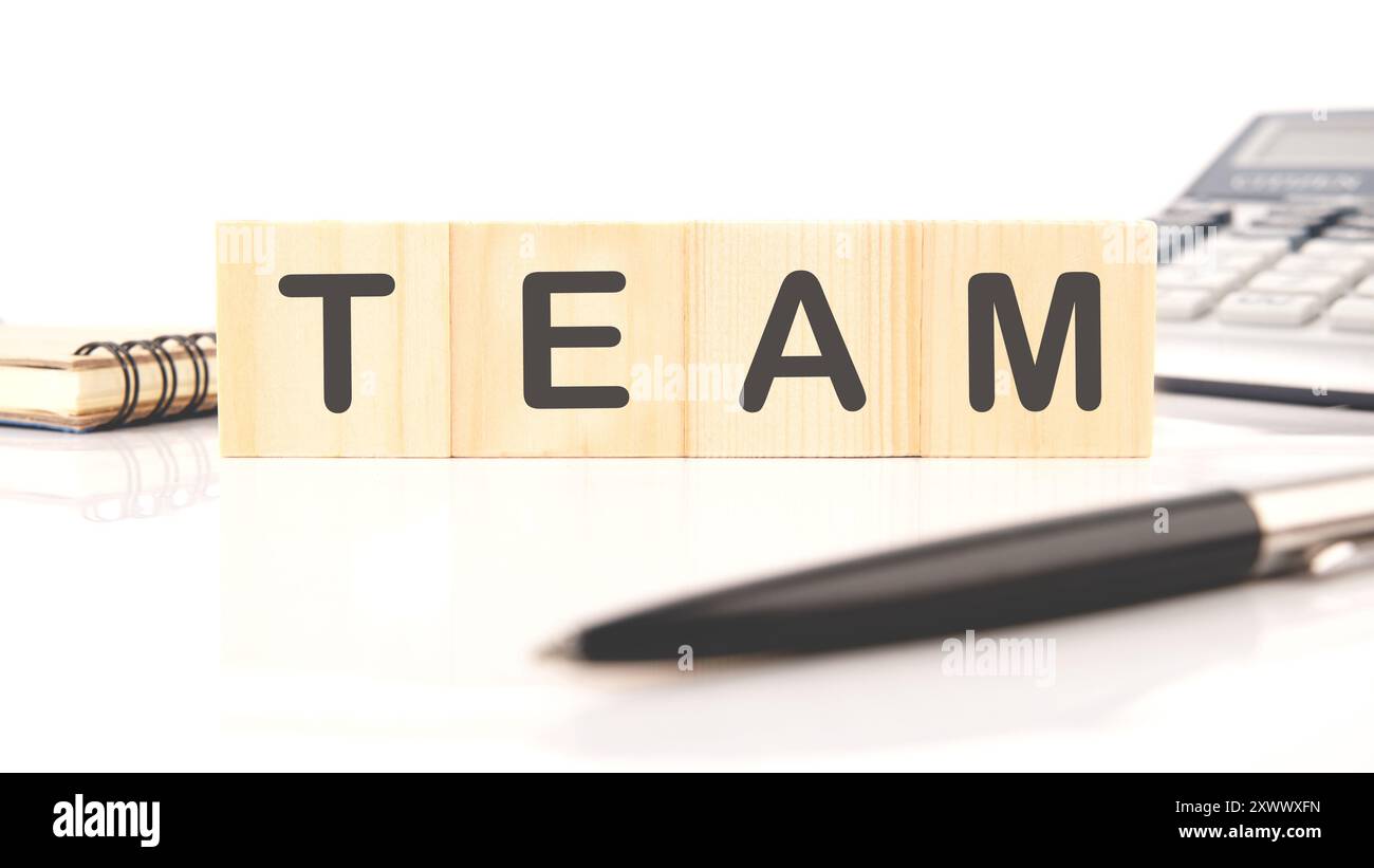 Business concept, the concept word TEAM assembled from wooden cubes on ...
