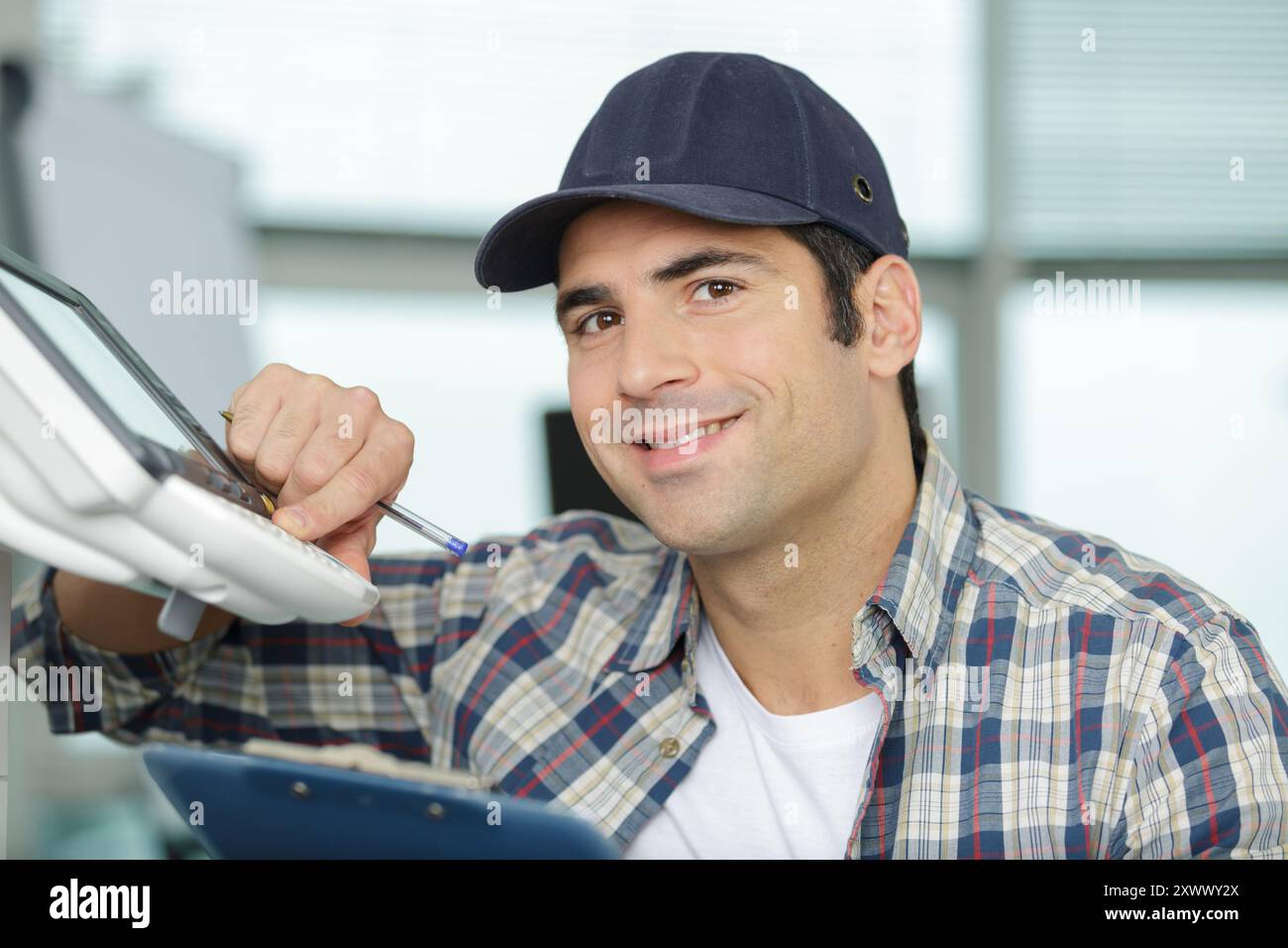 happy man fixing a printer Stock Photo - Alamy
