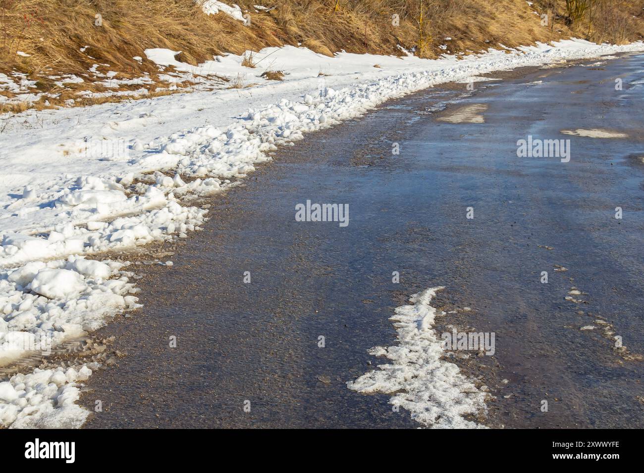 Snow-covered road, the marks of wheels Stock Photo - Alamy