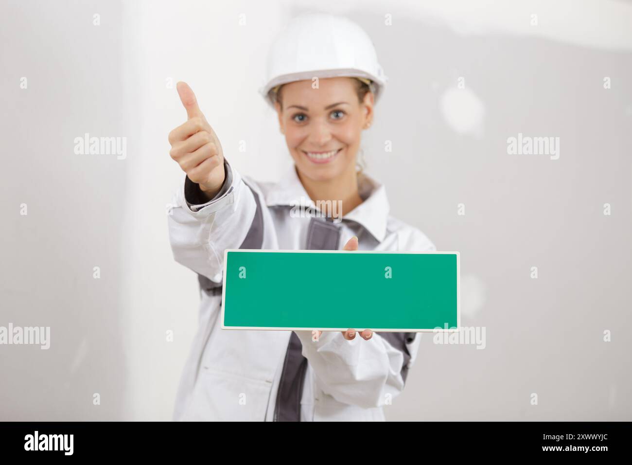 working woman showing a pannel Stock Photo - Alamy