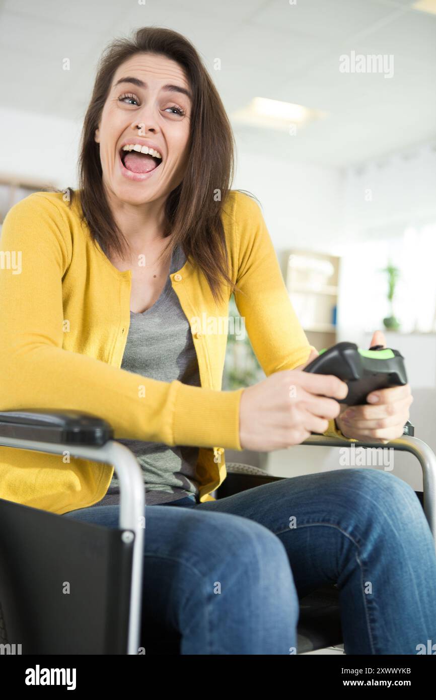 disabled female playing video game Stock Photo - Alamy