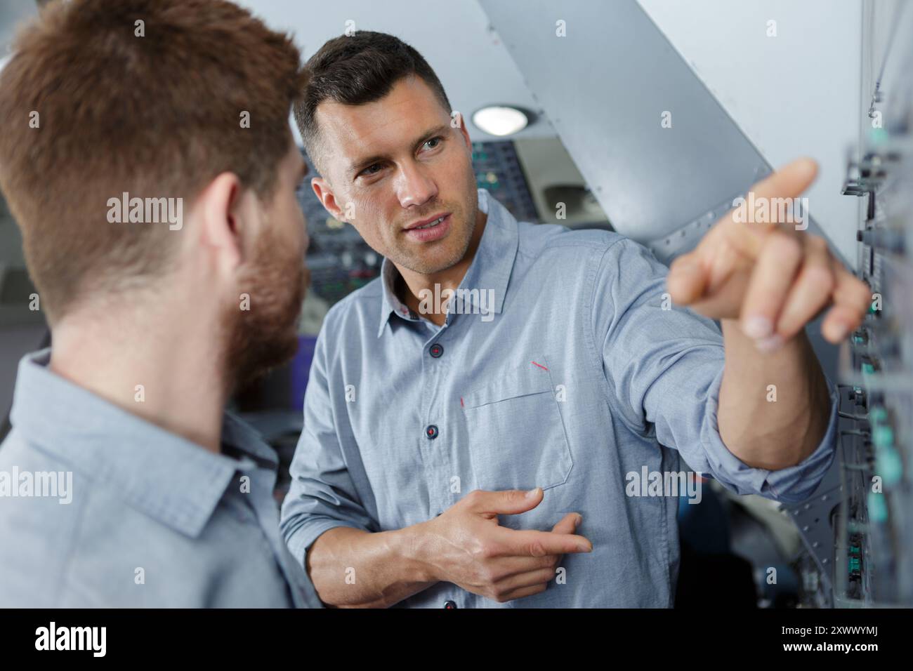 airplane service crew repairing plane Stock Photo - Alamy