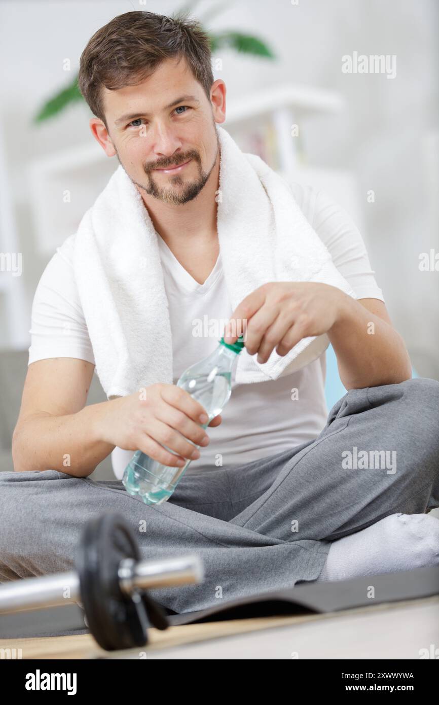 handsome sporty man resting after exercise Stock Photo - Alamy