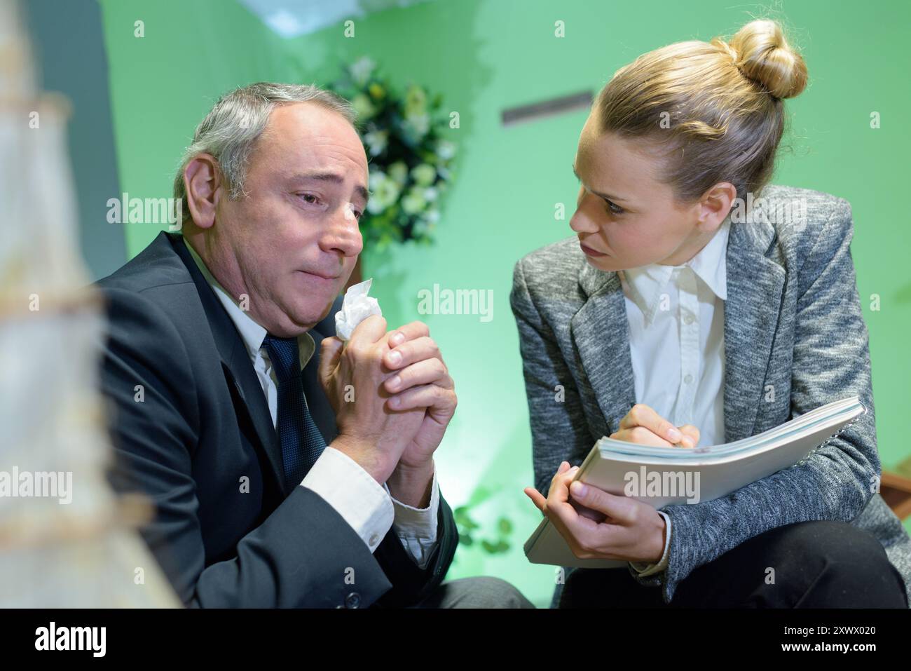 man crying next to woman Stock Photo - Alamy