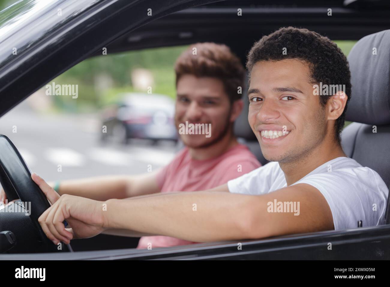 portrait of a young man driving his car Stock Photo - Alamy