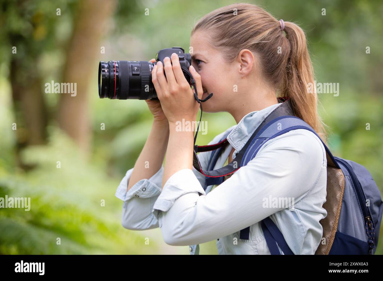 Female traveler photographing nature hi-res stock photography and ...