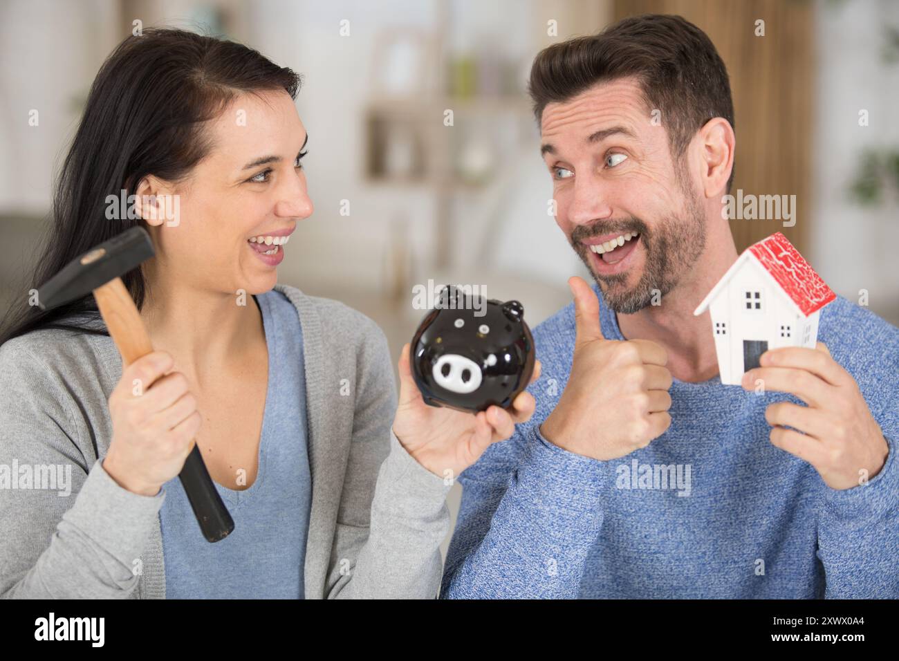 Hammer smashing into a house hi-res stock photography and images - Alamy