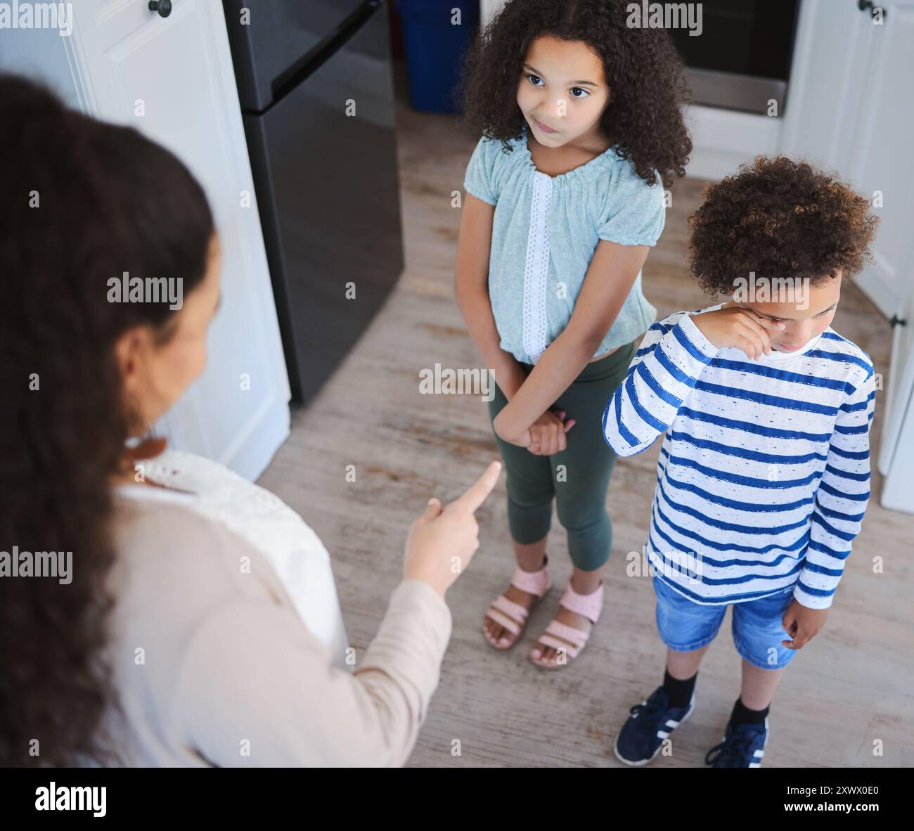 Home, naughty and mother with kids, angry and bad behavior with ...