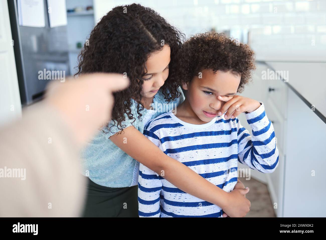 Children, sad and hug in home with discipline, scolding and support in ...
