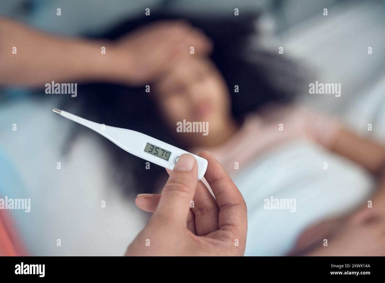 Parents, child and thermometer for symptoms of fever, cold or virus in bedroom with worry ...