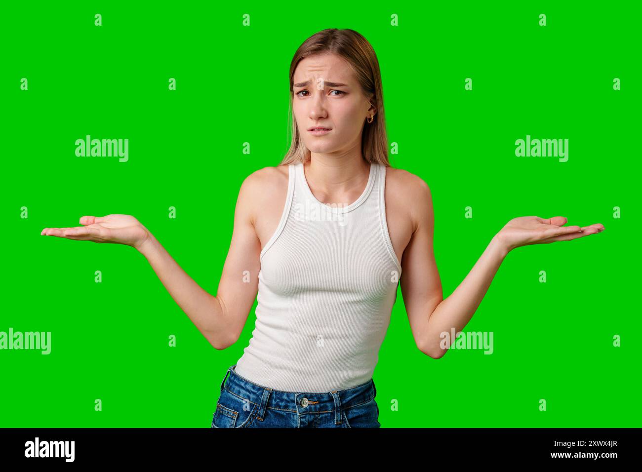 Young Woman With Confused Expression Against Green Screen Stock Photo ...