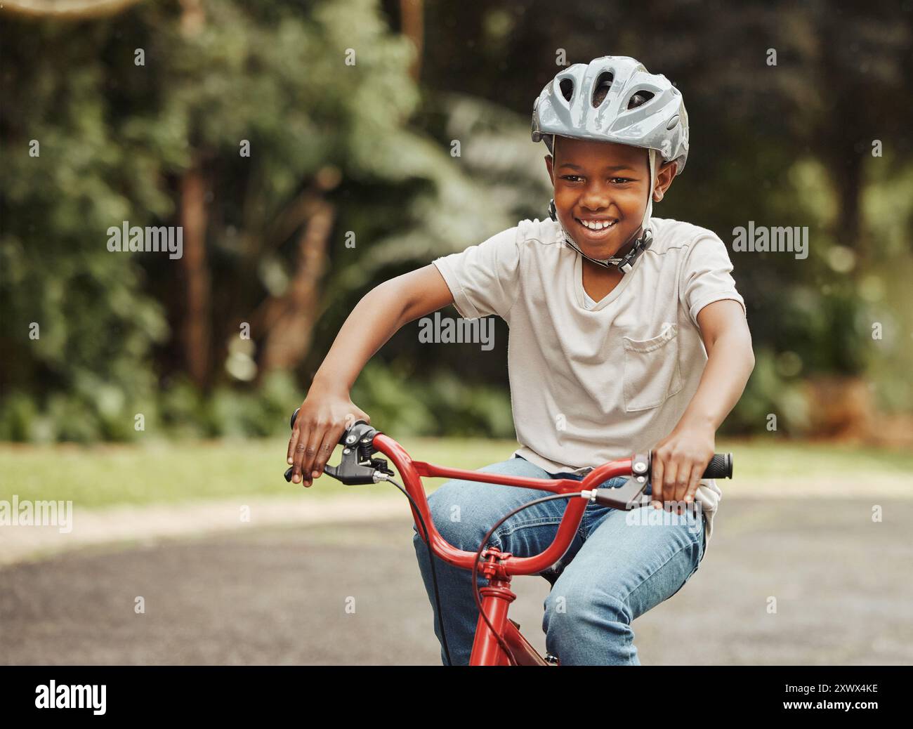Boy riding bicycle in black hi-res stock photography and images - Alamy