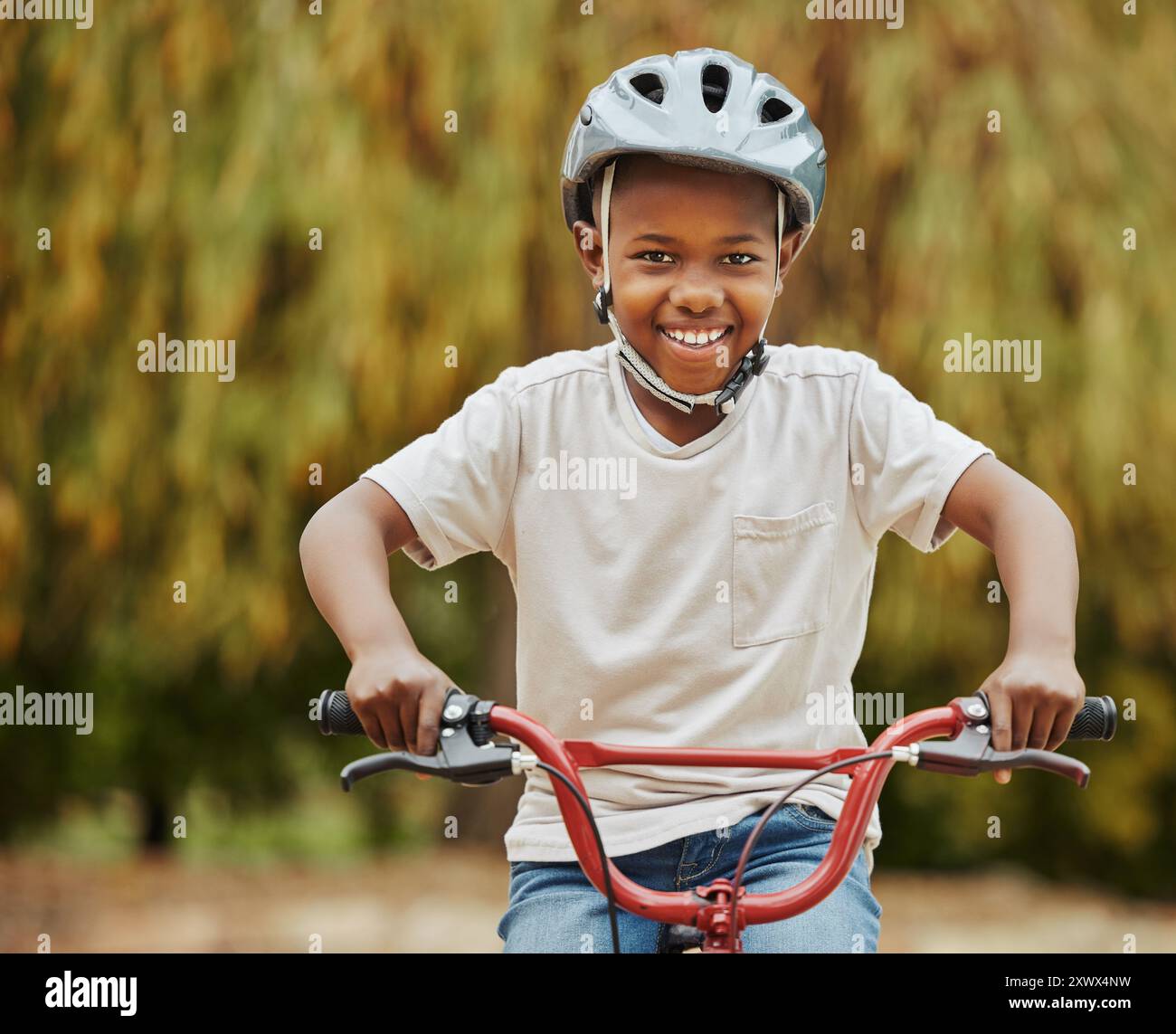 Black child, portrait and bicycle with helmet for ride, acitivty or ...