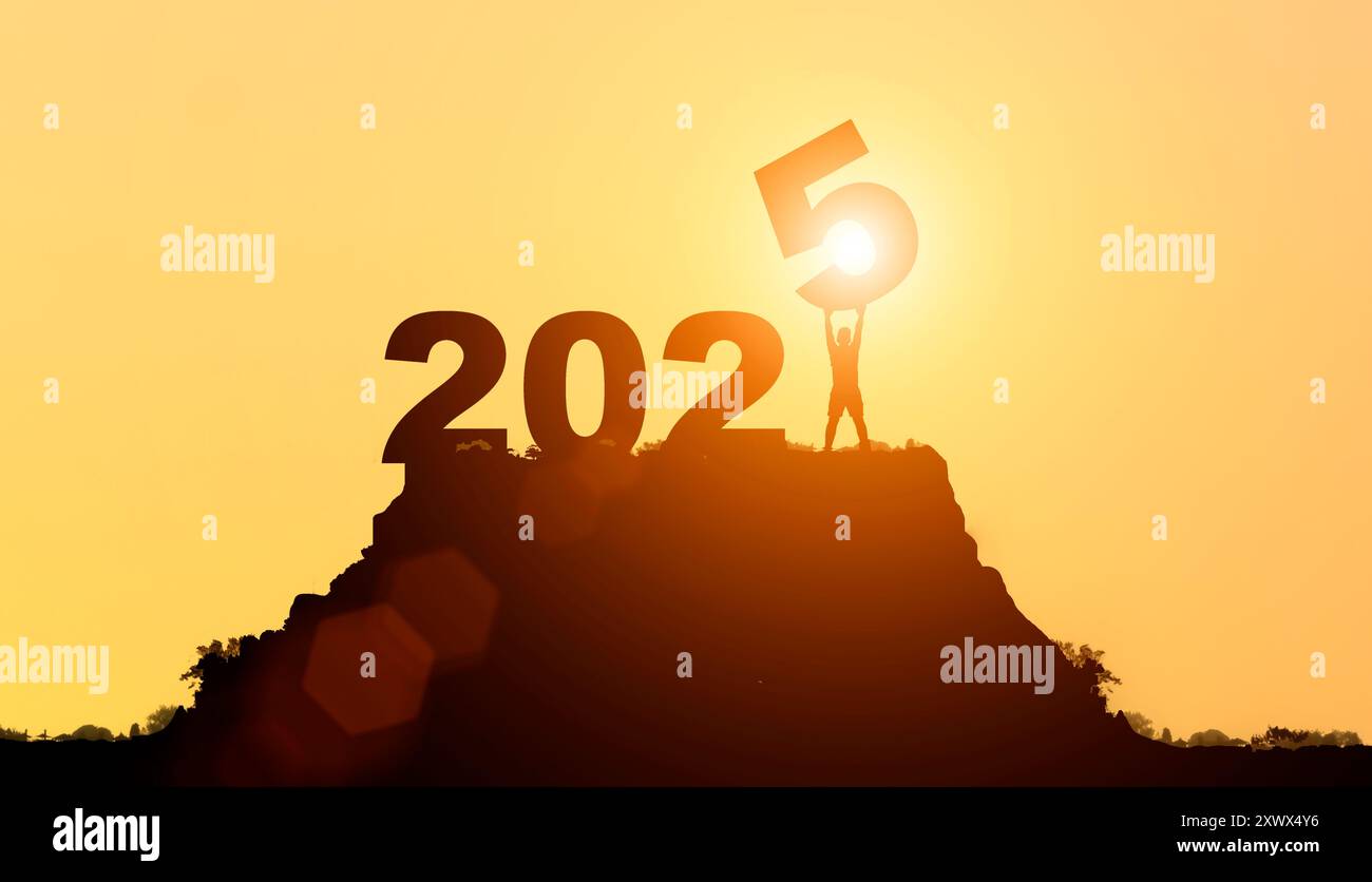 2025 year concept. Silhouettes of active people in nature against the ...